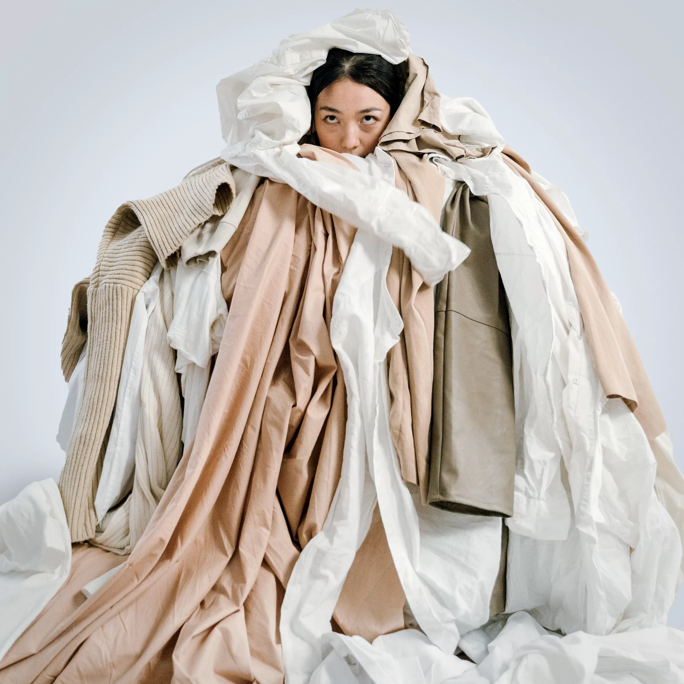 The Art of Folding: Mastering Neat Clothes Piles - Dry Cleaning Connection